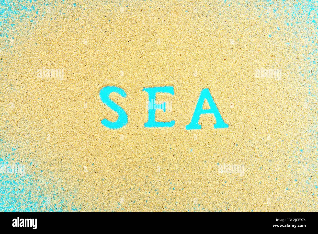 Word SEA written in the sand Stock Photo - Alamy