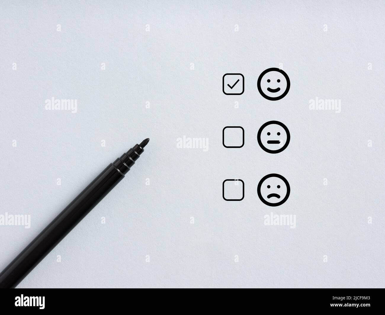 Tick placed in checkbox of selected happy emoticon. Customer ...