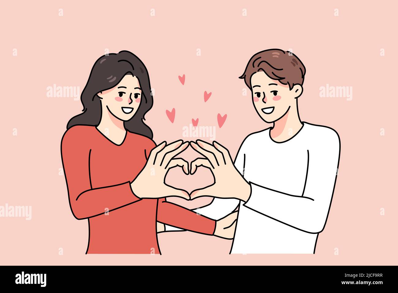 Happy couple hug show heart sign with hands. Smiling man and woman ...