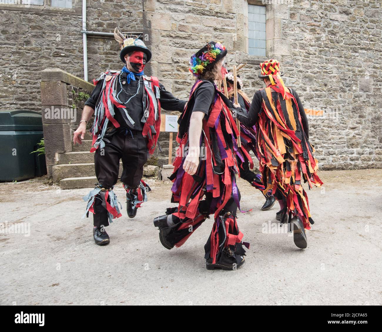 Flagcrackers of Craven border morris side in colourful rag jackets ...