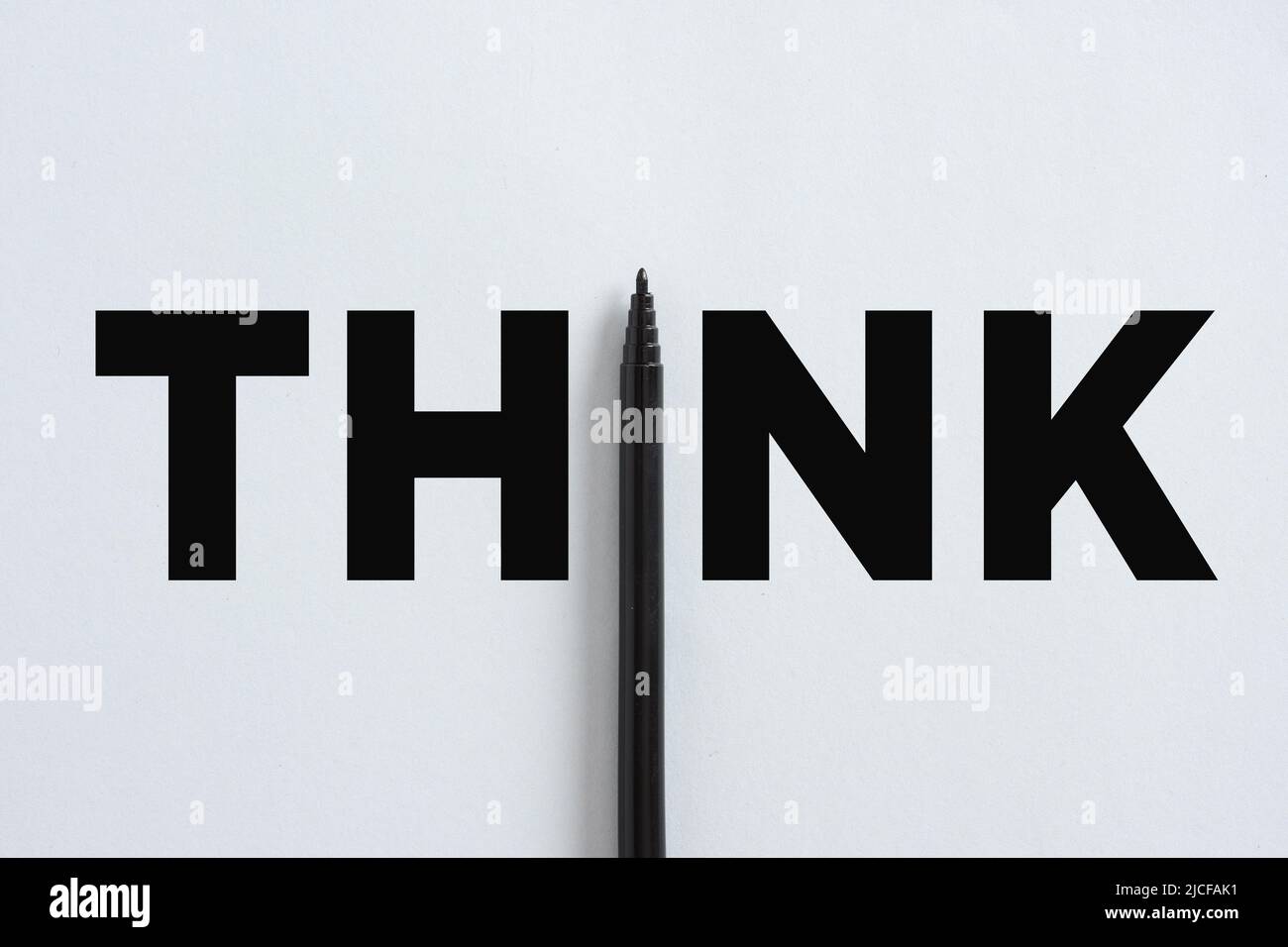 The word think with a felt tip pen usen as the letter i. Thinking ...