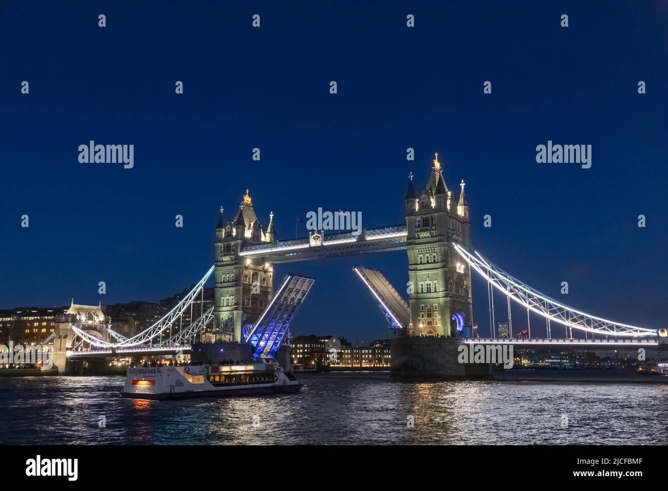 England, London, Tower Bridge Open at Night and City Cruises River Boat ...