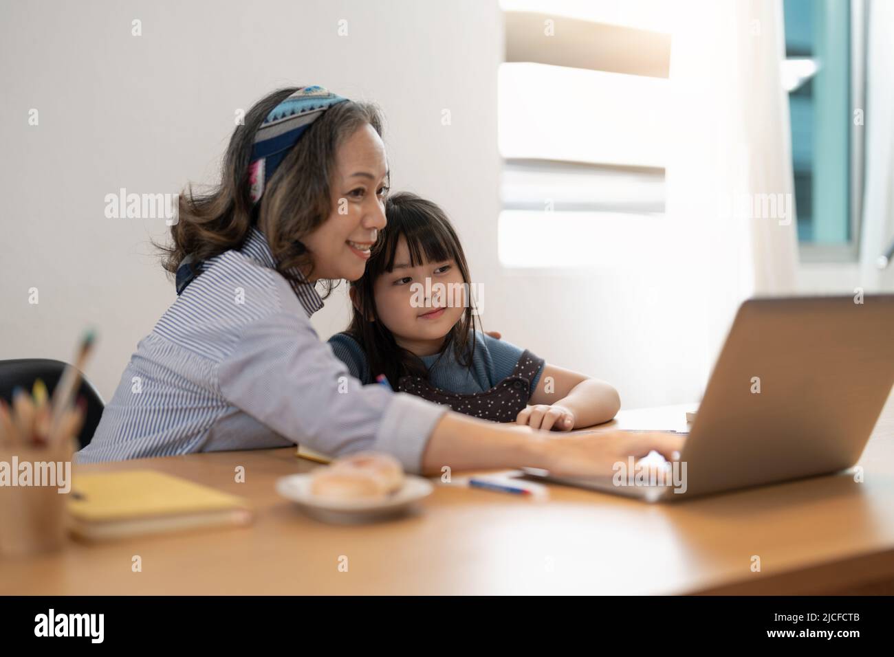 Old woman learning hi-res stock photography and images - Alamy