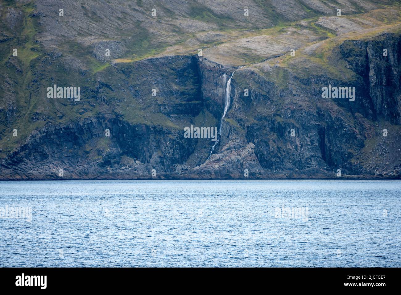 Norway, Troms og Finnmark, coastal landscape with waterfall near ...