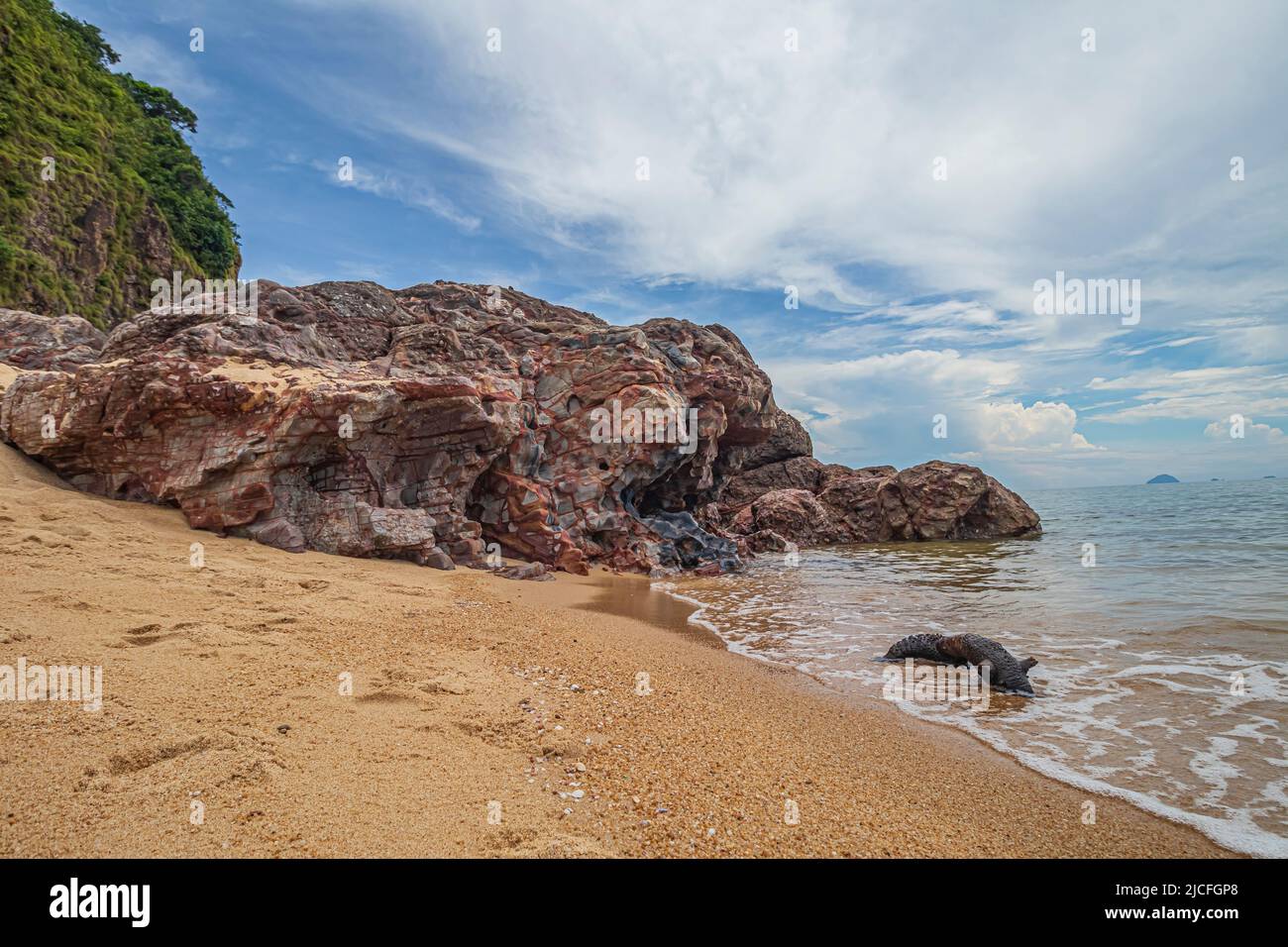 Sea side landscape with rock formations and vegetation clad rocky ...