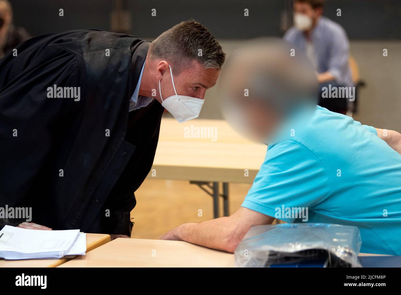 Verden, Germany. 13th June, 2022. The defendant talks to his lawyer ...
