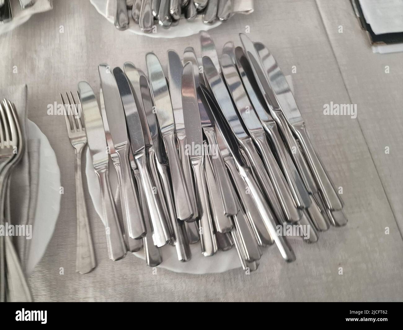 Silverware on the table detail Stock Photo - Alamy