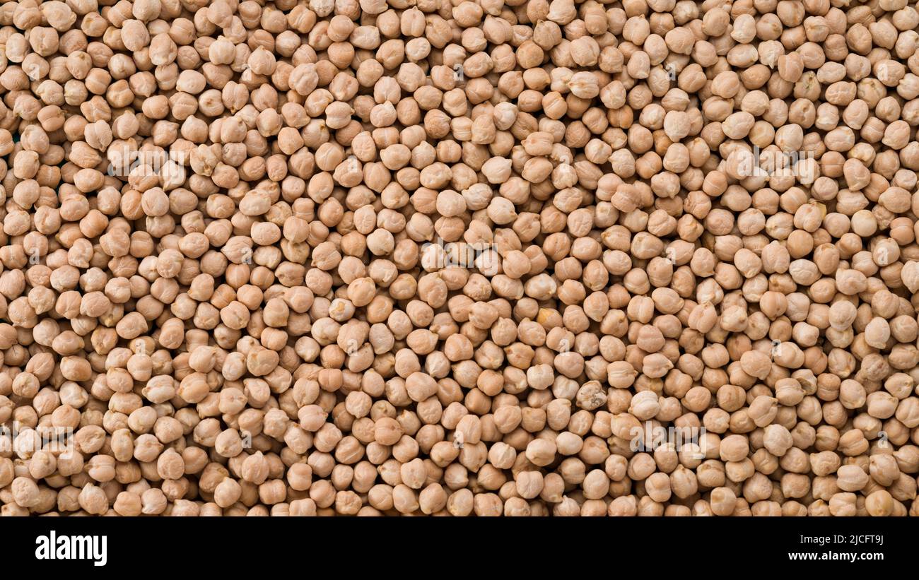 Food background from a texture of raw chickpeas close-up. Dried organic ...