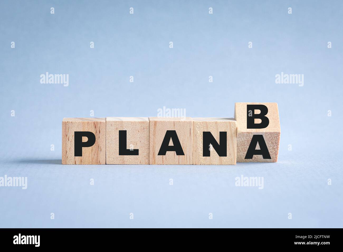 Wooden cube blocks with Plan A change to Plan B text. Business and ...