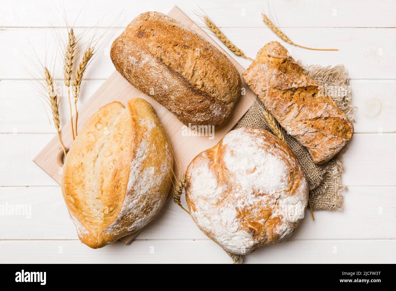 Homemade natural breads. Different kinds of fresh bread as background ...