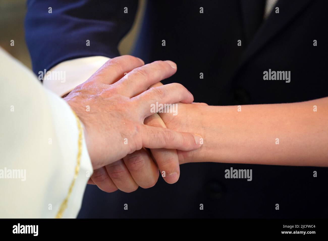 Two hands crossed in hi-res stock photography and images - Alamy