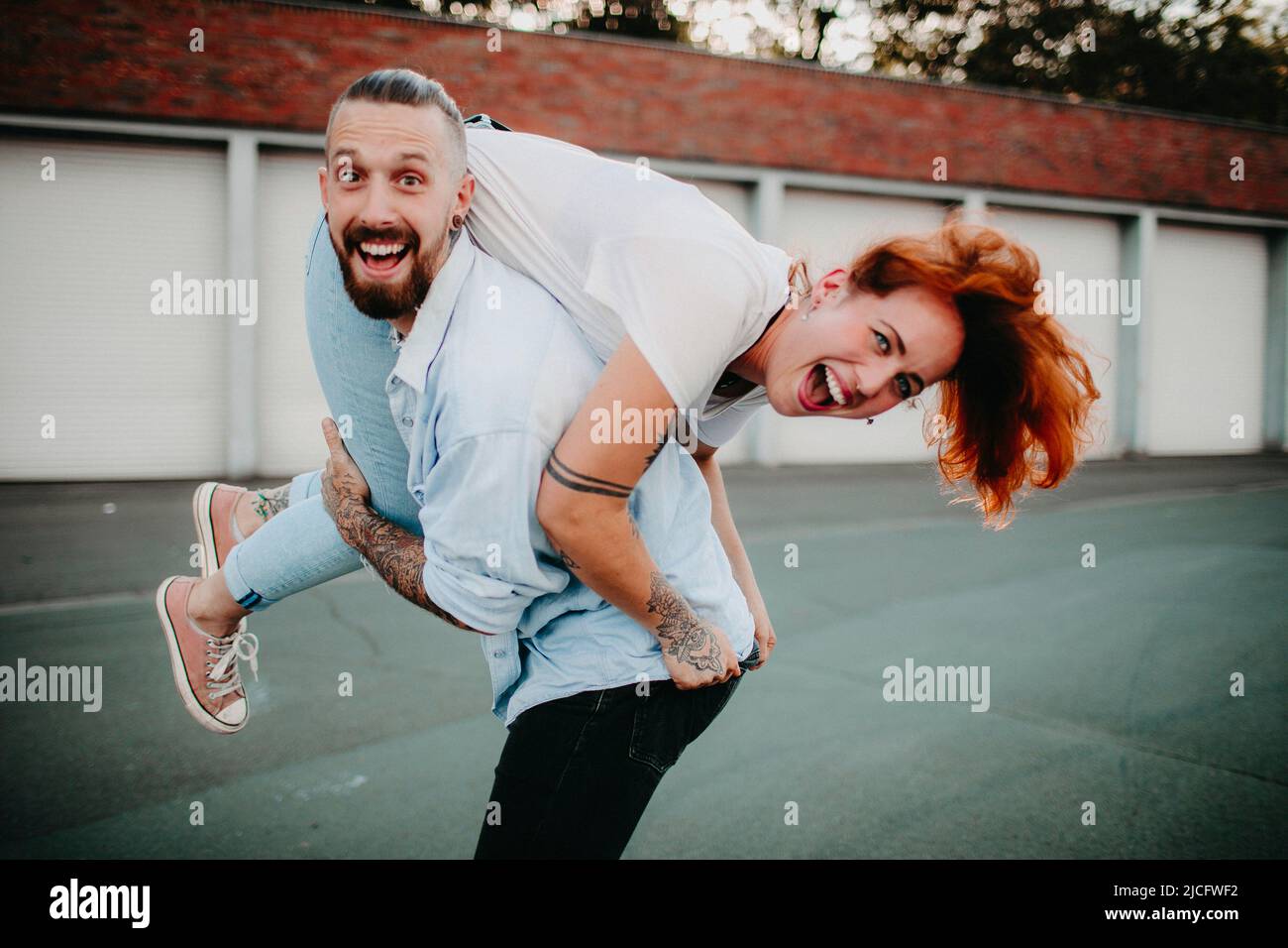 Young couple in love, fun, fooling around, outside Stock Photo - Alamy