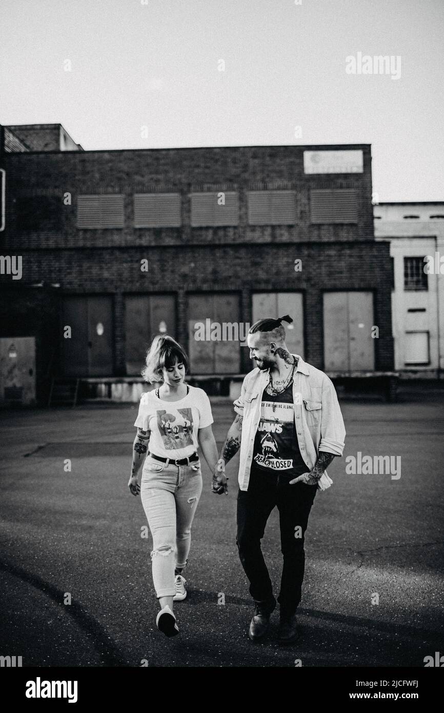 Young couple hold hands walk hi-res stock photography and images - Alamy