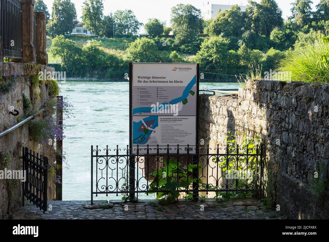 Rheinfelden (Switzerland), old town, passage to the Rhine, warning sign ...