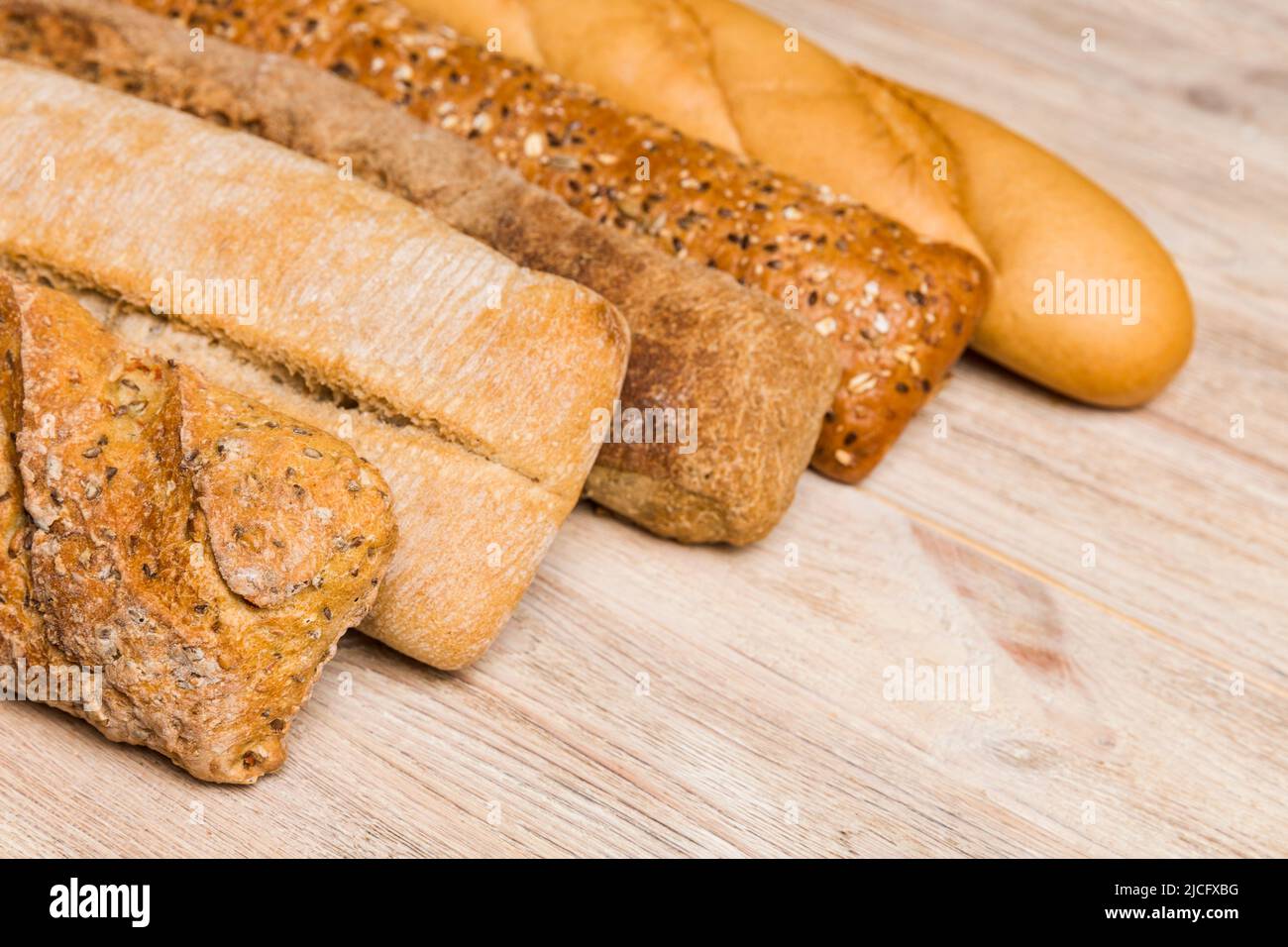 Homemade natural breads. Different kinds of fresh bread as background ...