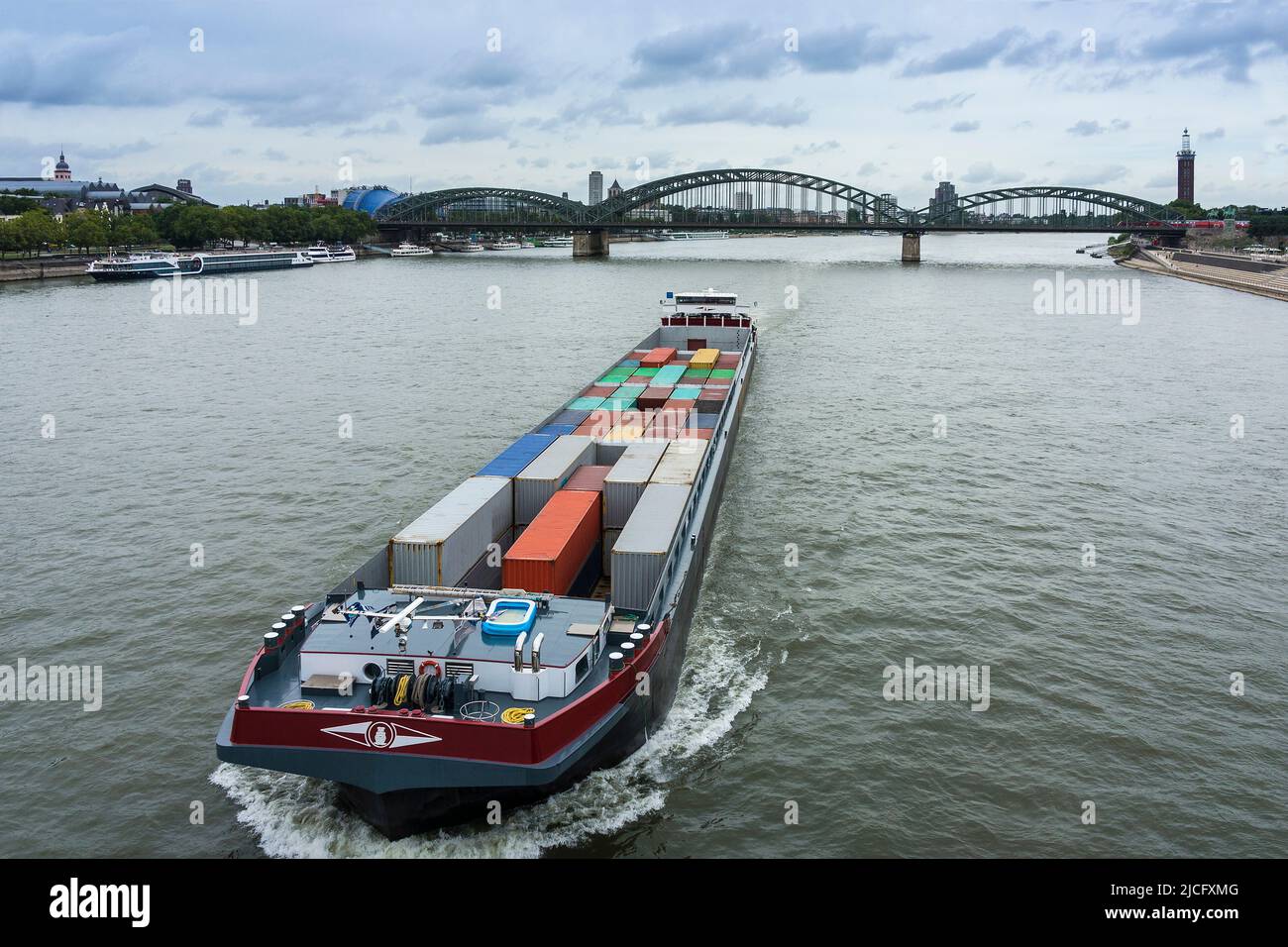 Germany, North Rhine-Westphalia, Cologne, cargo ship with containers on ...