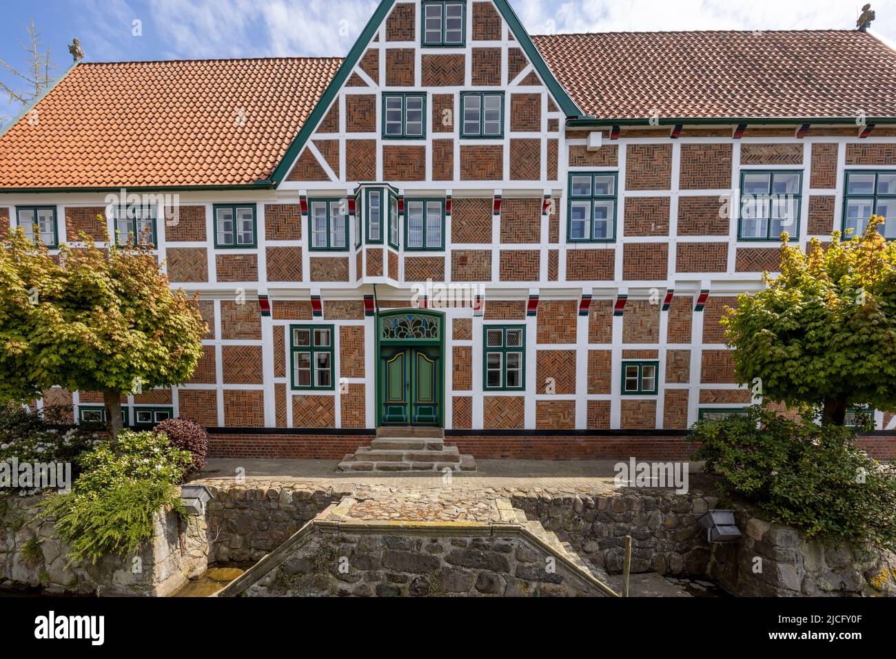 The town hall in Jork in the Alte Land in spring during apple blossom ...