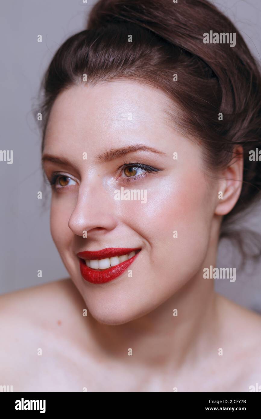 Portrait of a woman wearing classical elegant makeup - red lips and ...