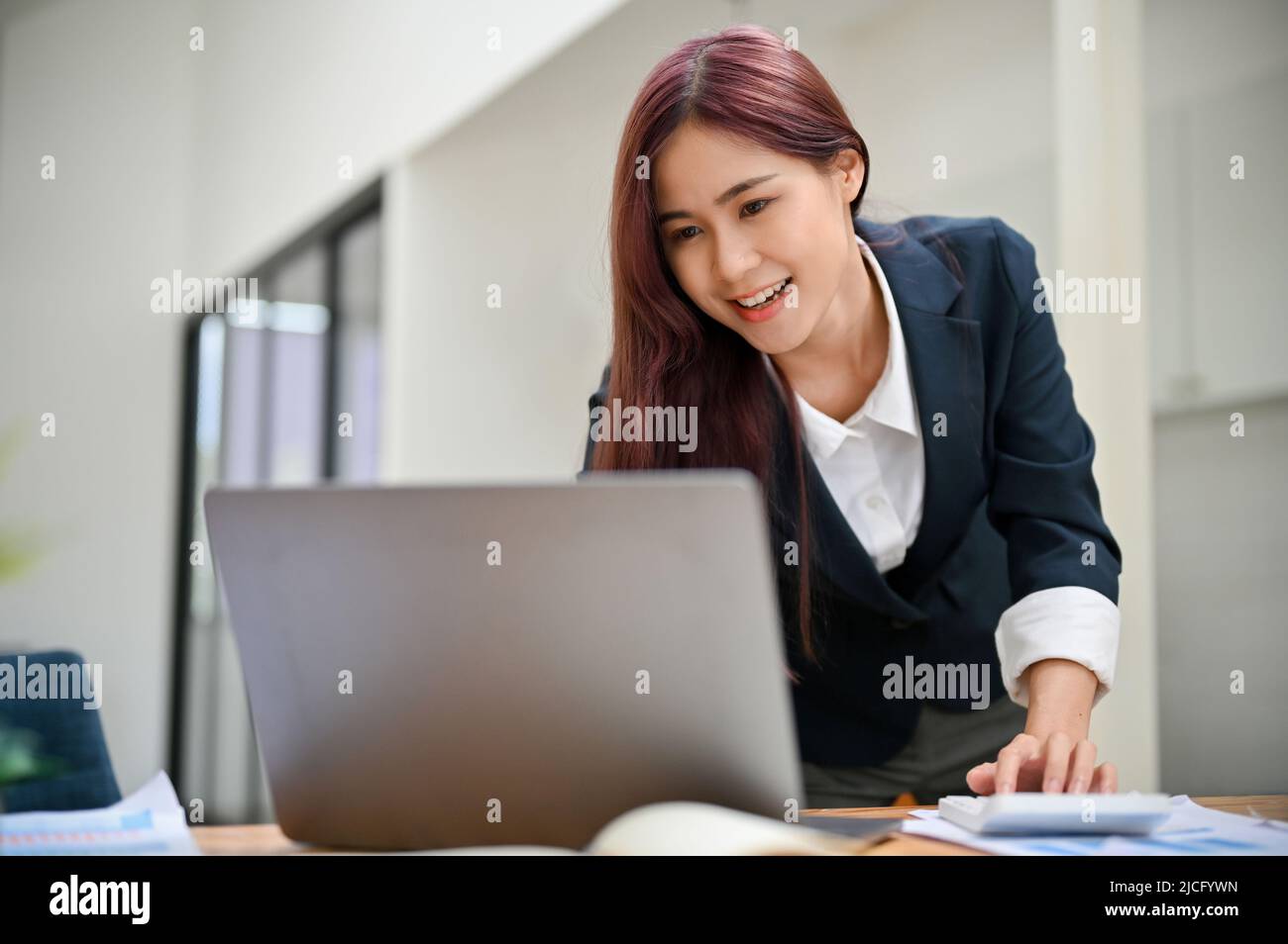 Gorgeous and attractive millennial asian businesswoman leaning working ...