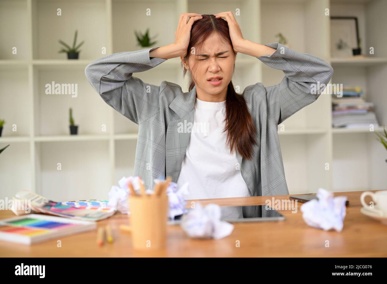 Angry stressed young asian female graphic designer frustrated with her ...