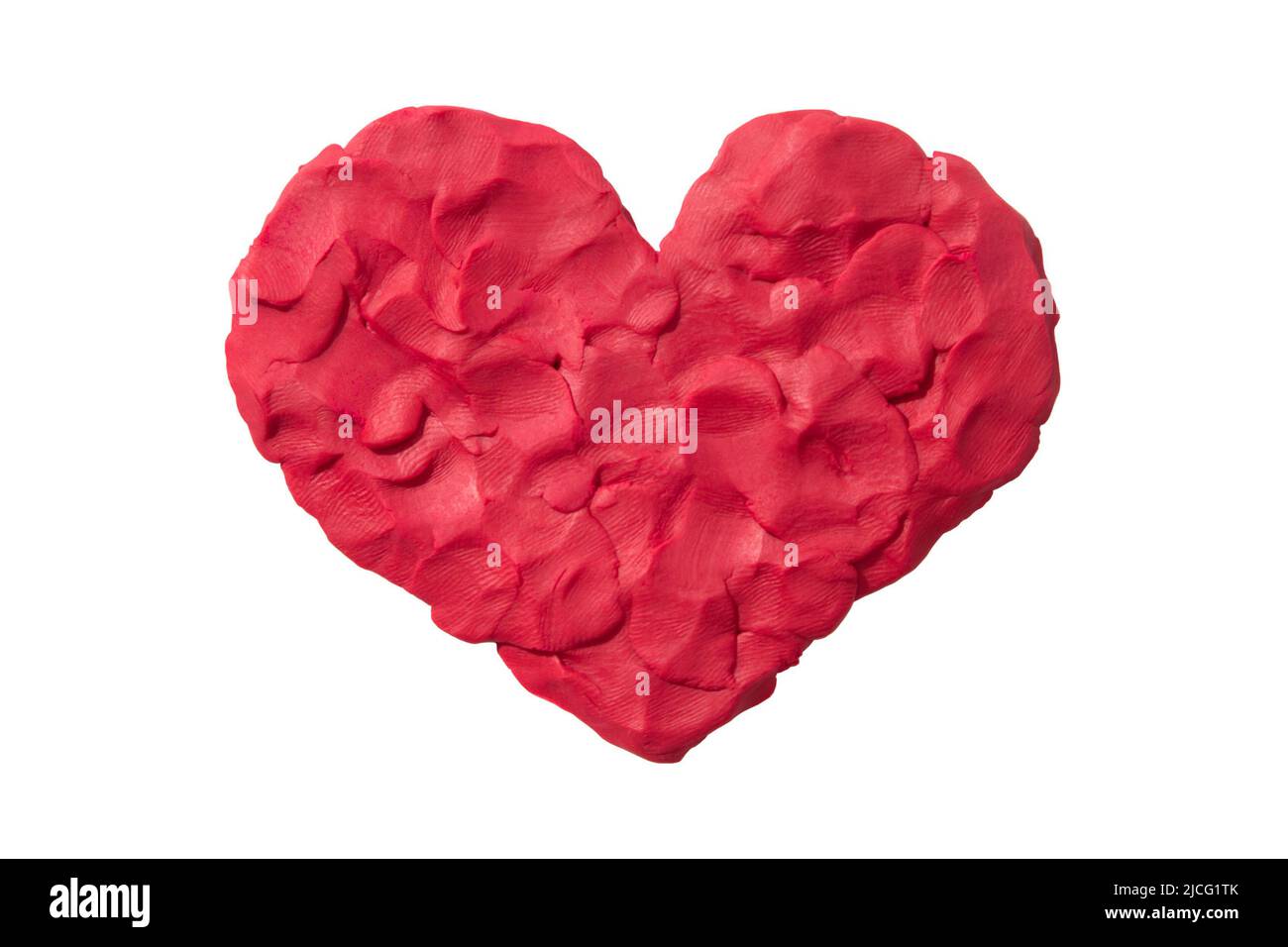 Heart shape of red plasticine modeling clay isolated on white ...