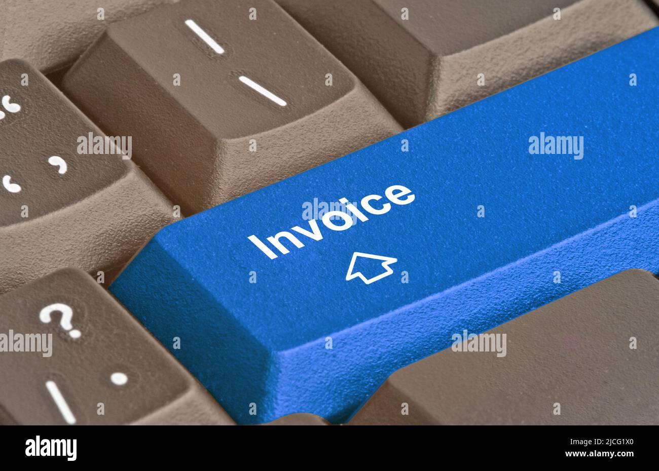 Keyboard with key for invoice Stock Photo - Alamy