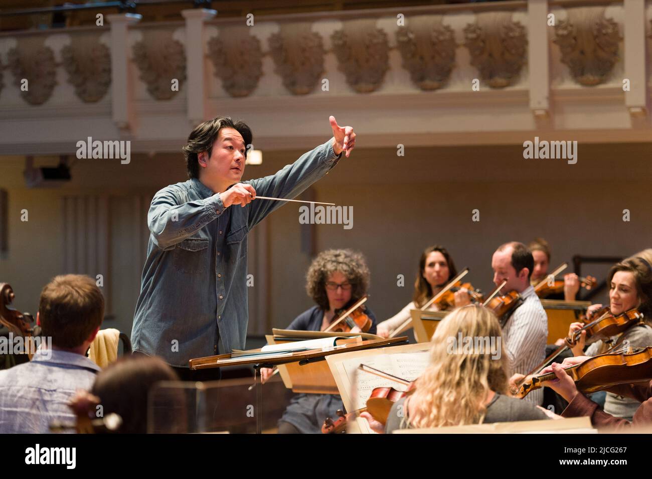 Japanese conductor Daisuke Muranaka conducting a rehearsal of the ...
