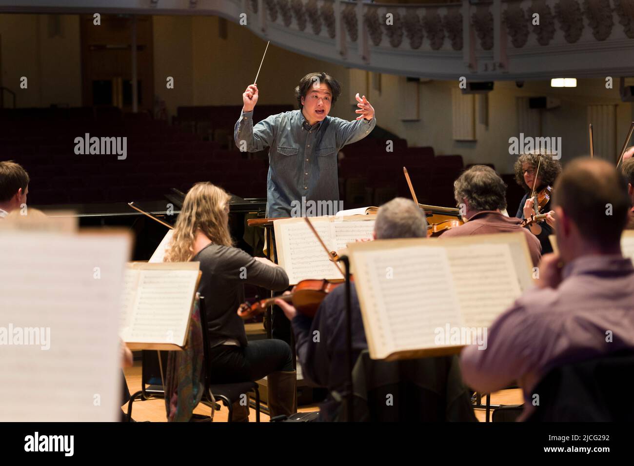 Japanese conductor Daisuke Muranaka conducting a rehearsal of the ...