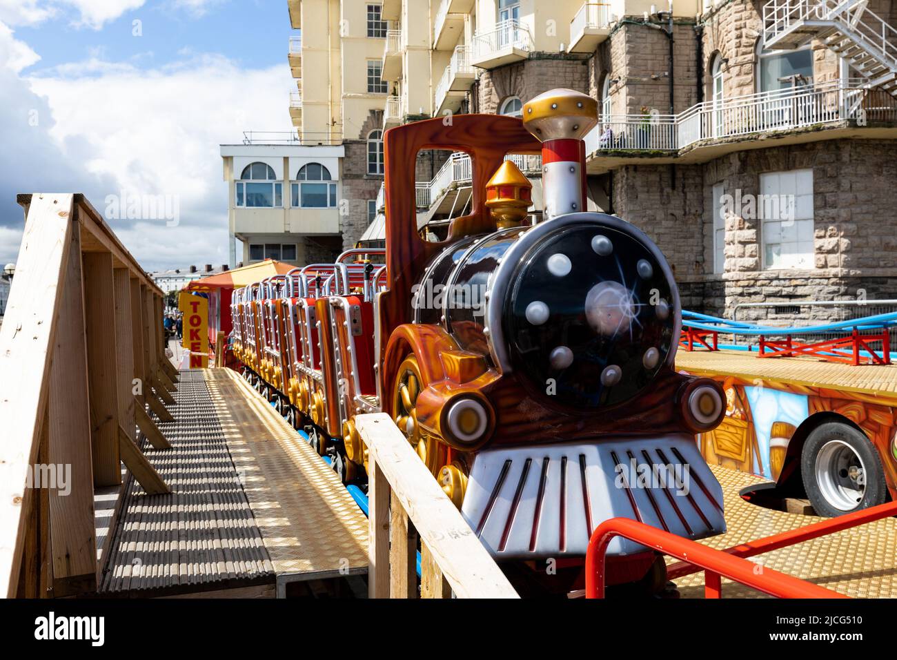 Children's ride (Train engine) on pier at Llandudno. North Wales UK ...