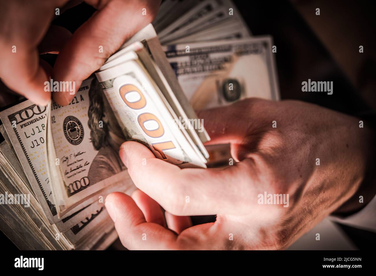One Hundred Dollar Banknotes in Cash Money Being Counted by a Male ...
