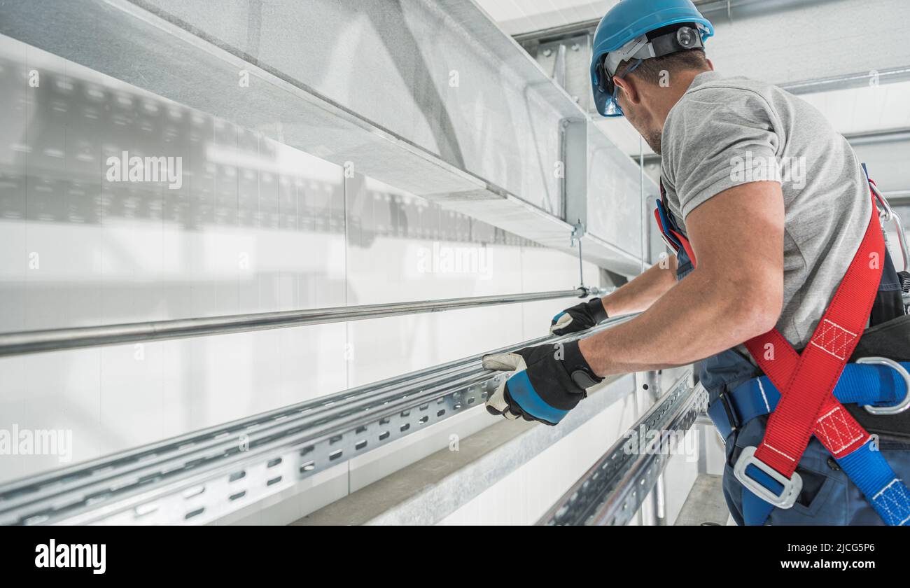 Professional Industry Worker Wearing Safety Harness Installing ...