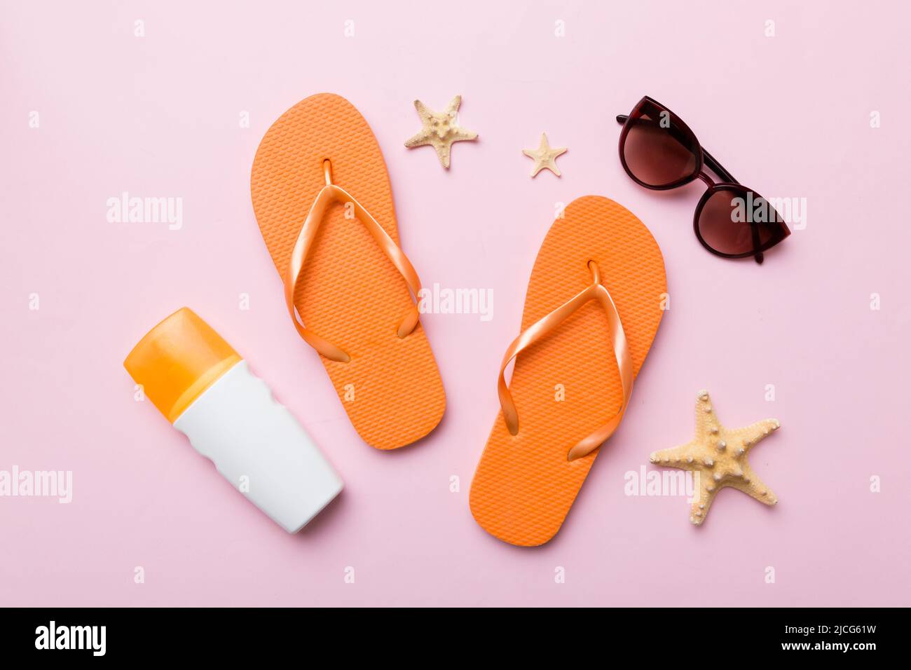 Summer travel concept. Flip flops, sunglasses and starfish on white ...