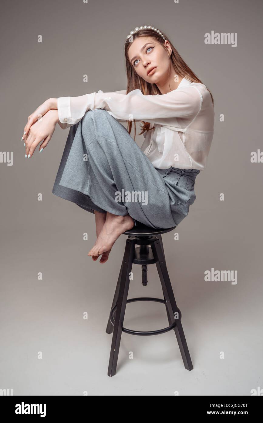 She sits sad hi-res stock photography and images - Alamy