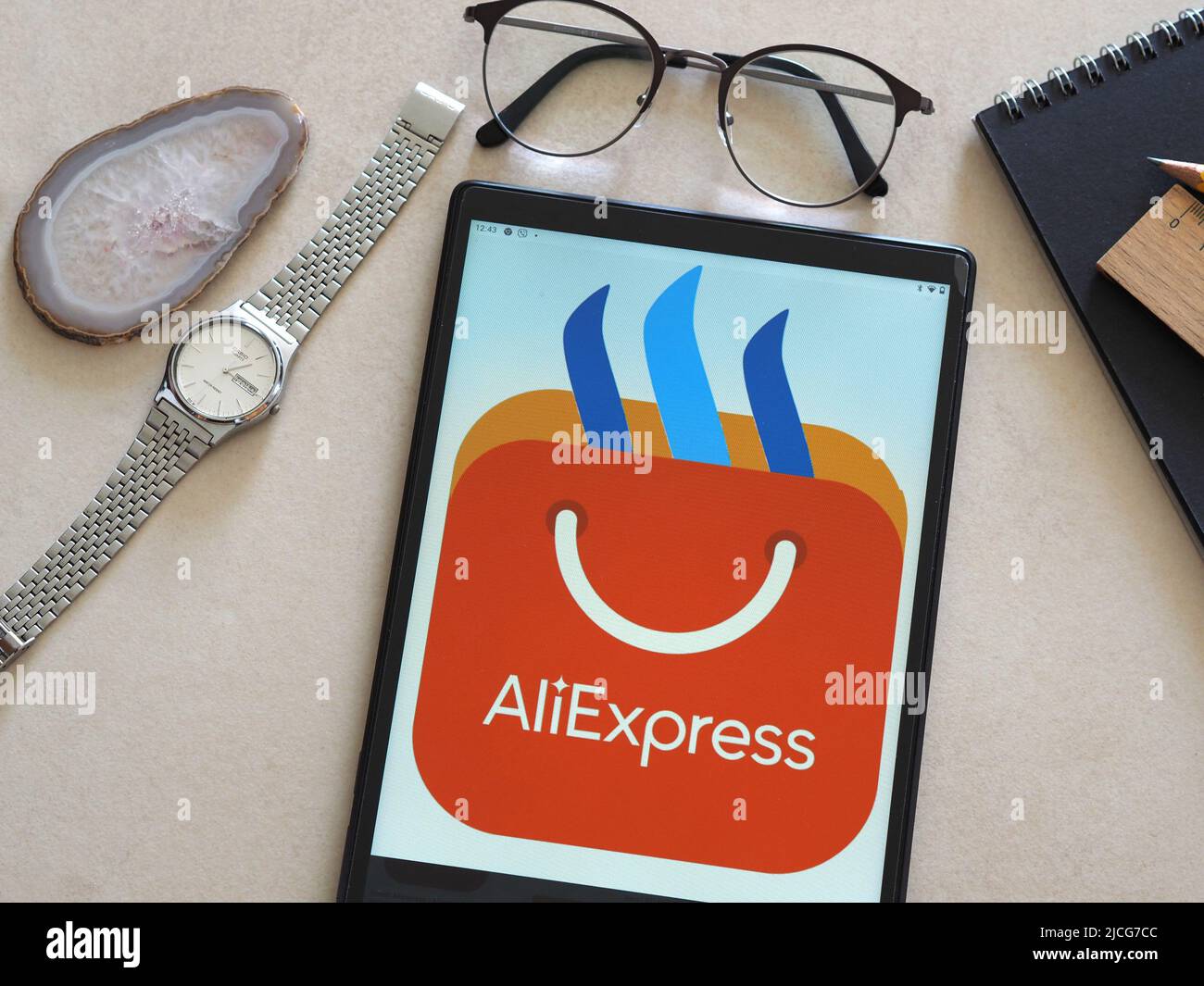 In this photo illustration AliExpress logo seen displayed on a tablet ...