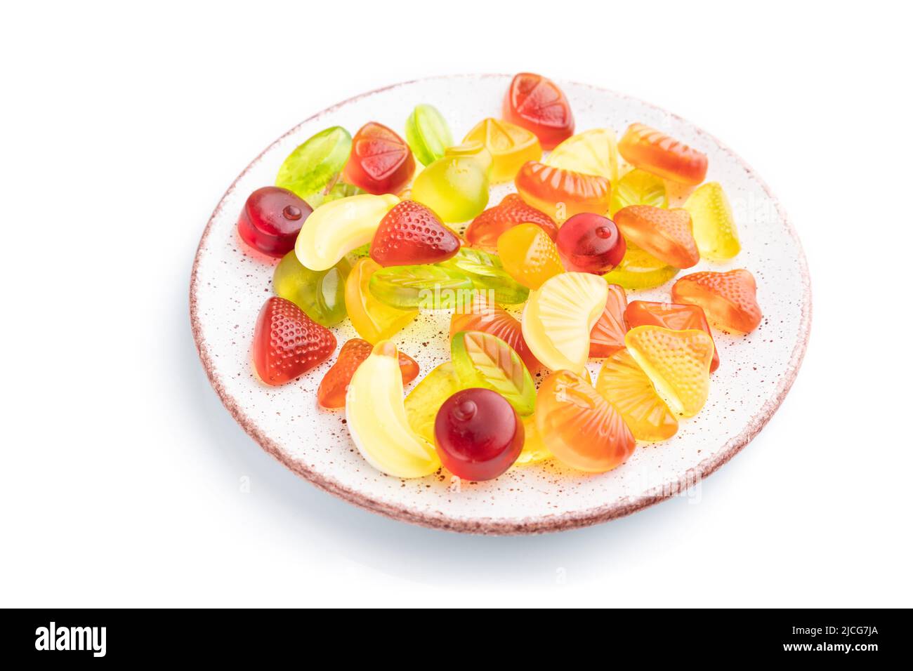 Various fruit jelly candies on plate isolated on white background. top ...