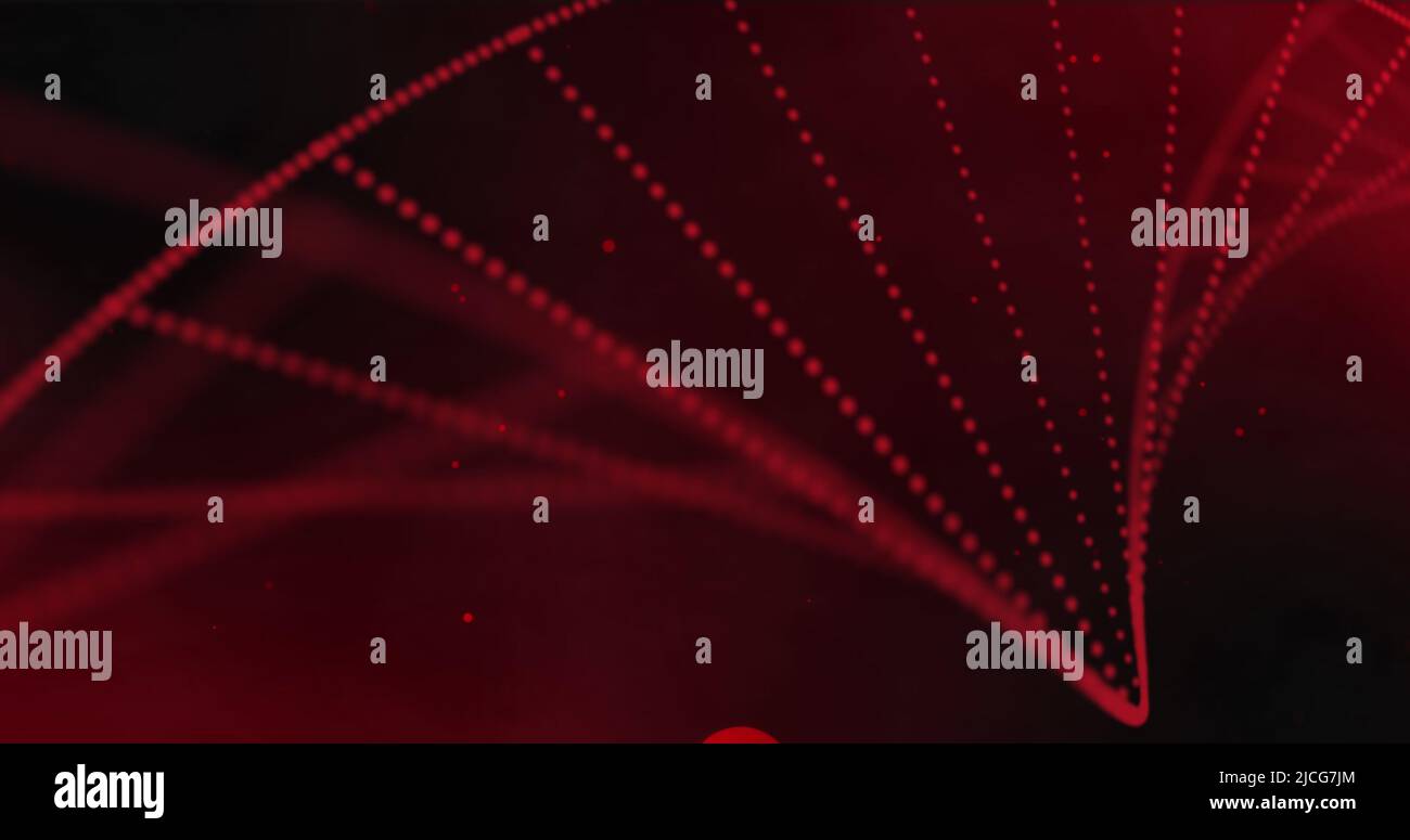 Image of red strand spinning with red spots on light on black ...