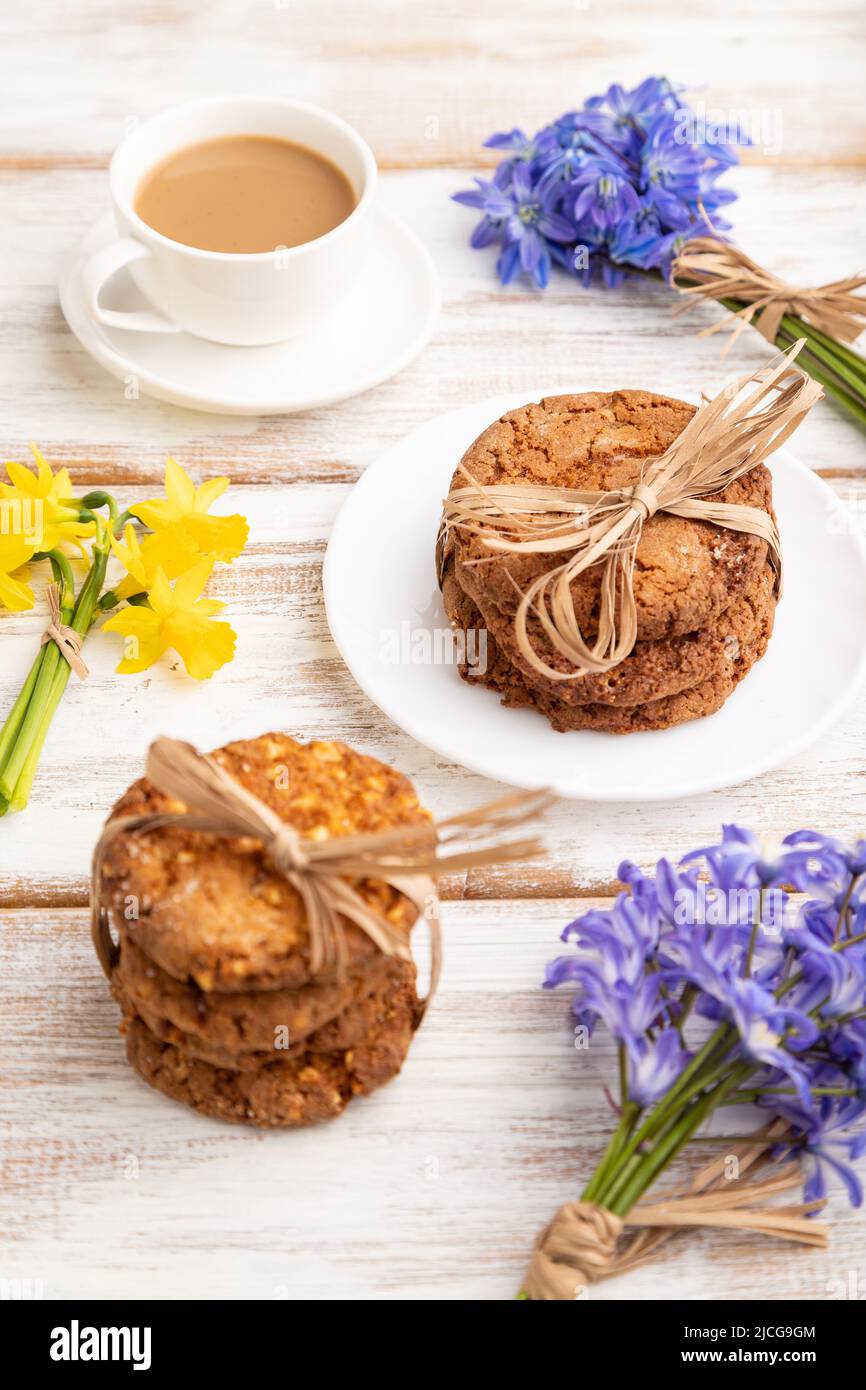 Oatmeal cookies with spring snowdrop flowers bluebells, narcissus and ...