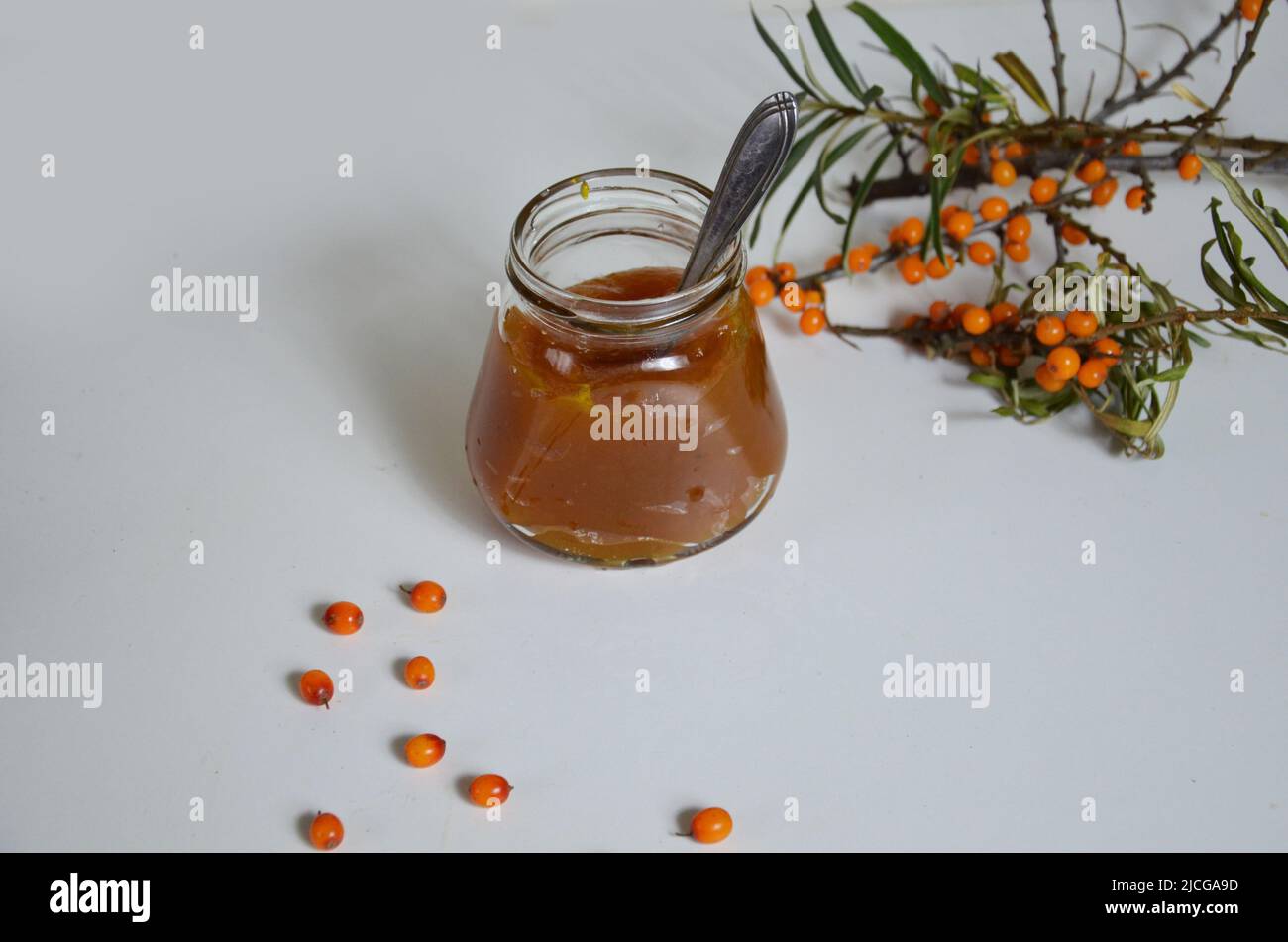 Homemade jam. Glass jar with sea buckthorn jam on rustic background ...