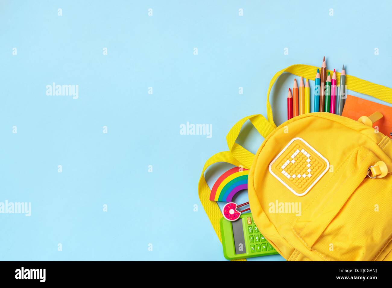 Back to school, education concept Yellow backpack with school supplies ...