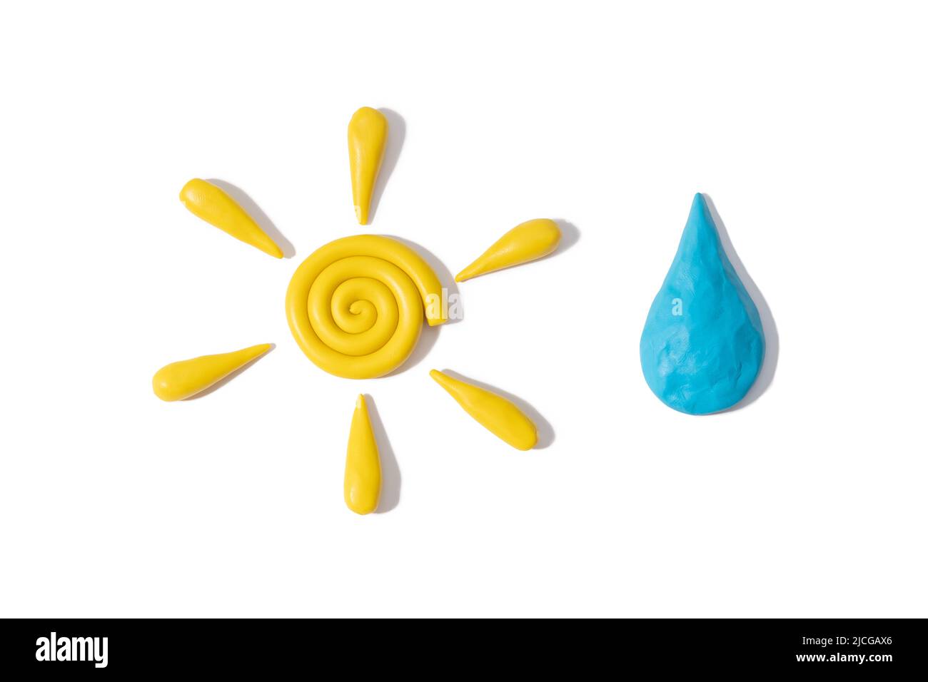 Yellow plasticine modeling clay finger textured sun and blue water drop ...