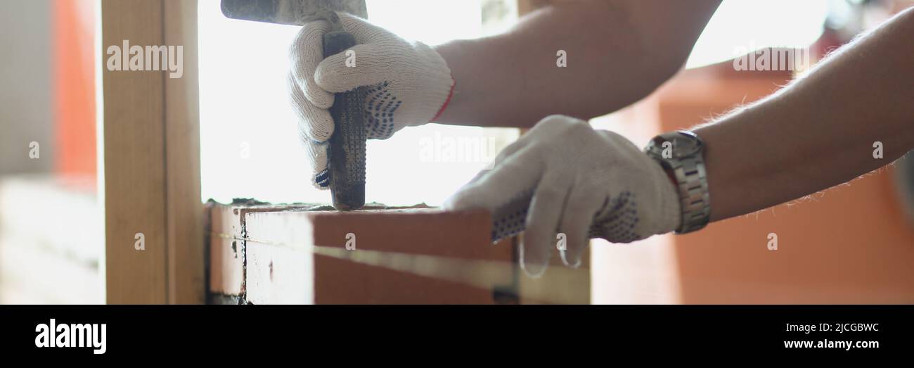 Foreman use special tool working with brick building wall in room Stock ...