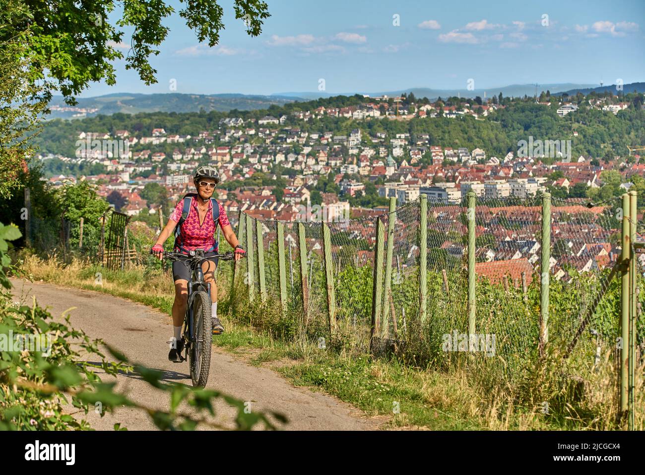 Nice active senior woman with electric mountain bike on a tour in the ...