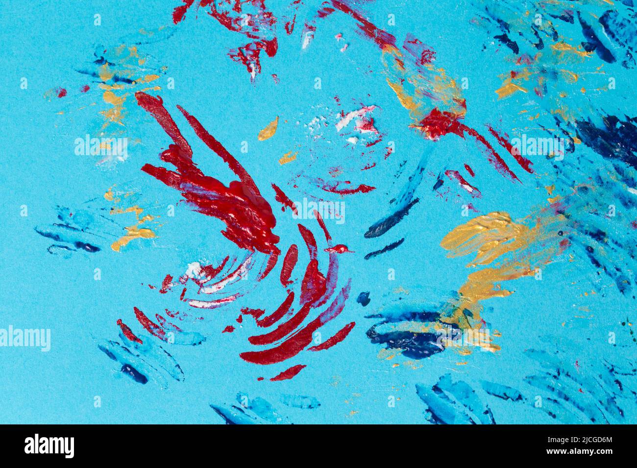 Multi-colored stains of paint on a blue background. Abstract background ...