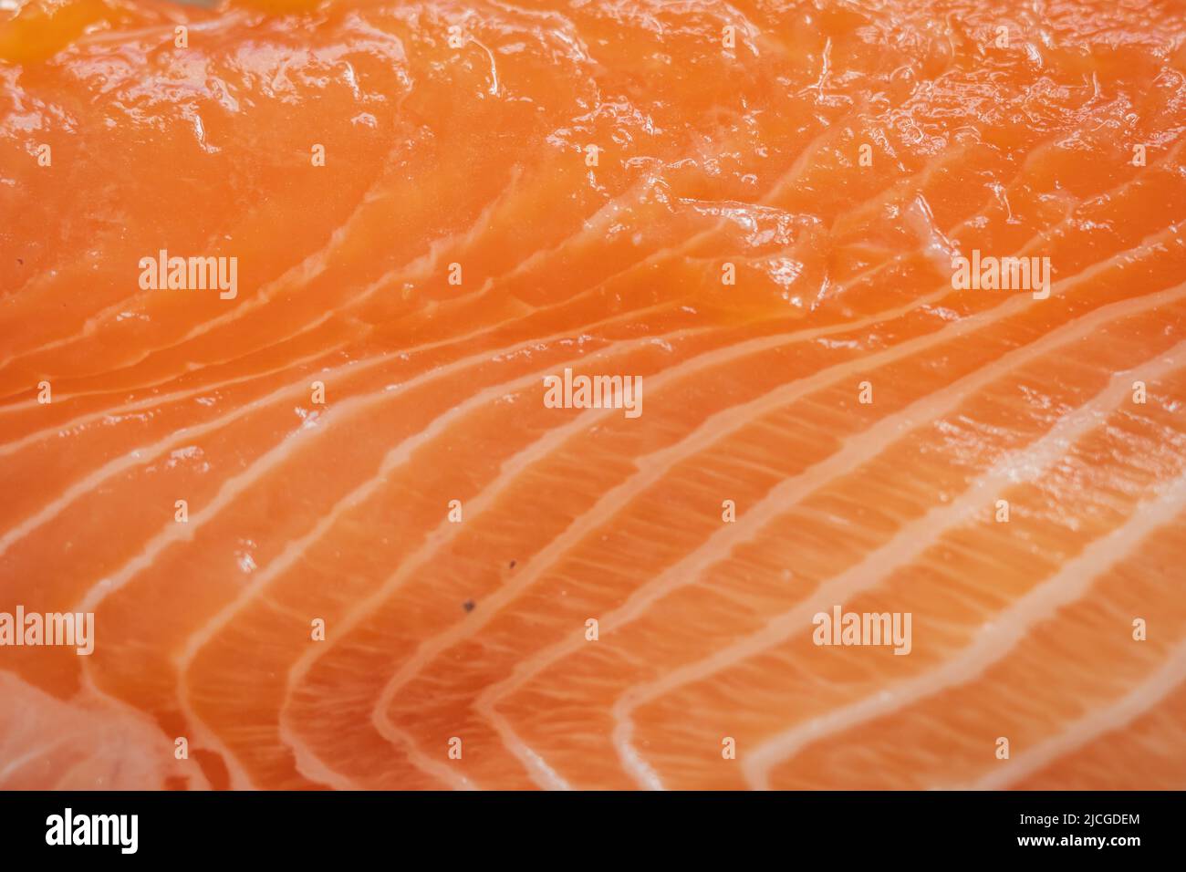 Raw salmon trout fish fillet texture closeup Stock Photo - Alamy