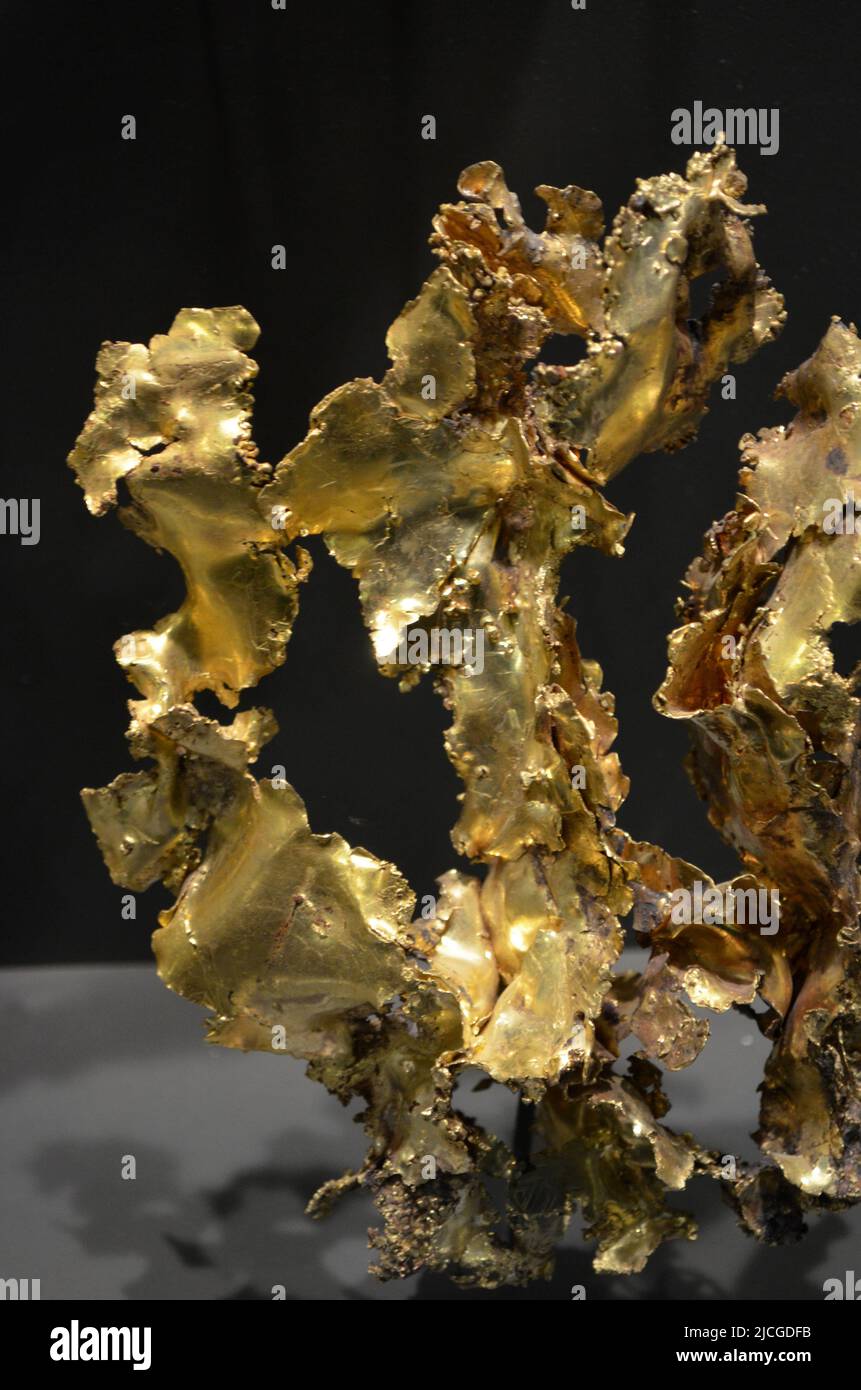 Flakes of genuine gold in an unsual free form shape Stock Photo - Alamy