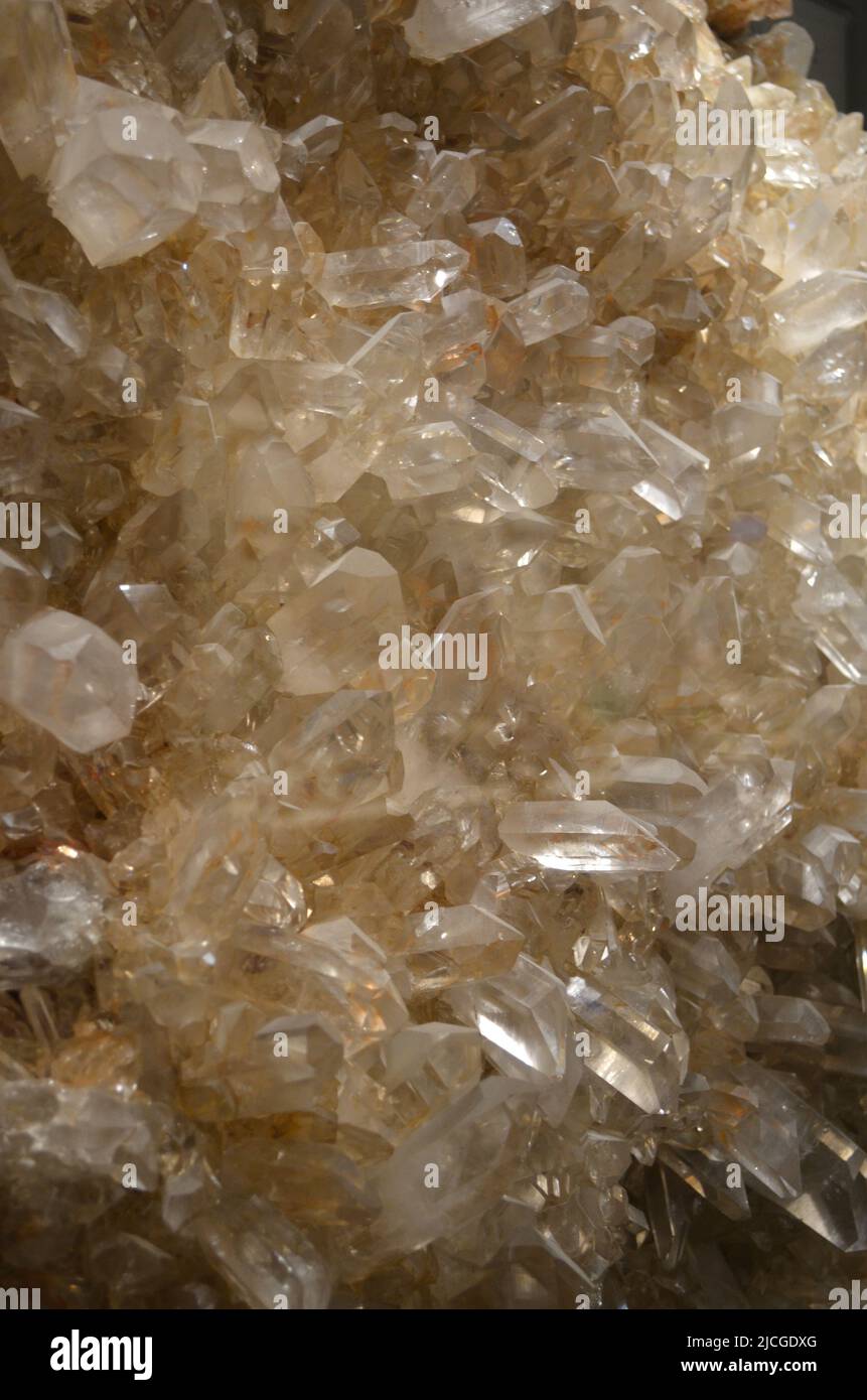Large cluster of clear crystal quartz stones growing together in a ...