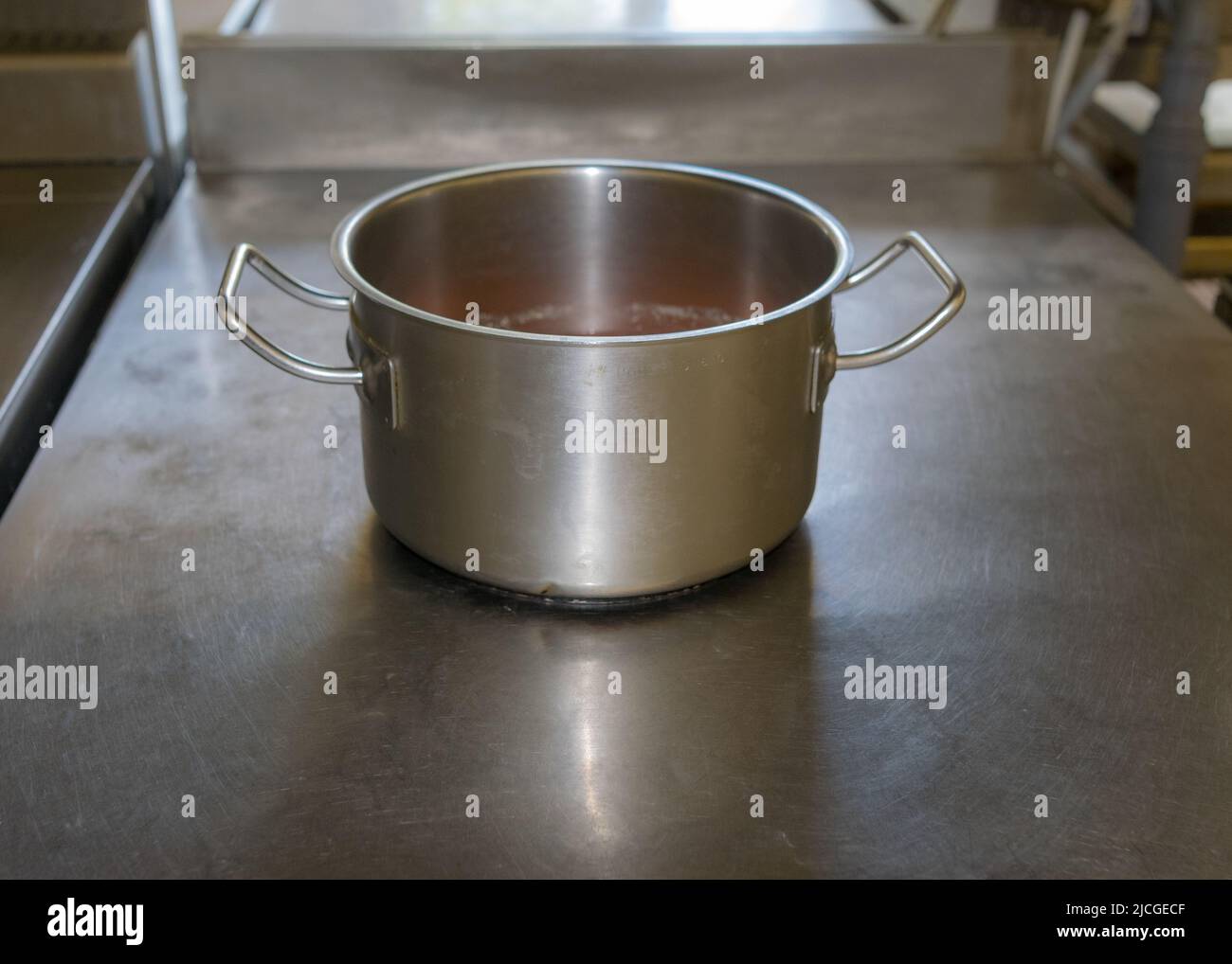 school kitchen canteen, metal pots on the stove surface, canteen ...