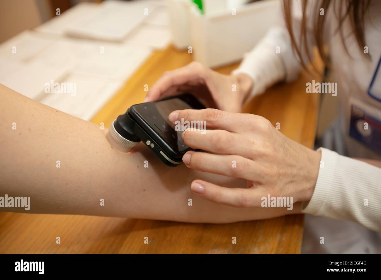 Doctor Dermatologist Examining Birthmarks And Moles On A Female Patient