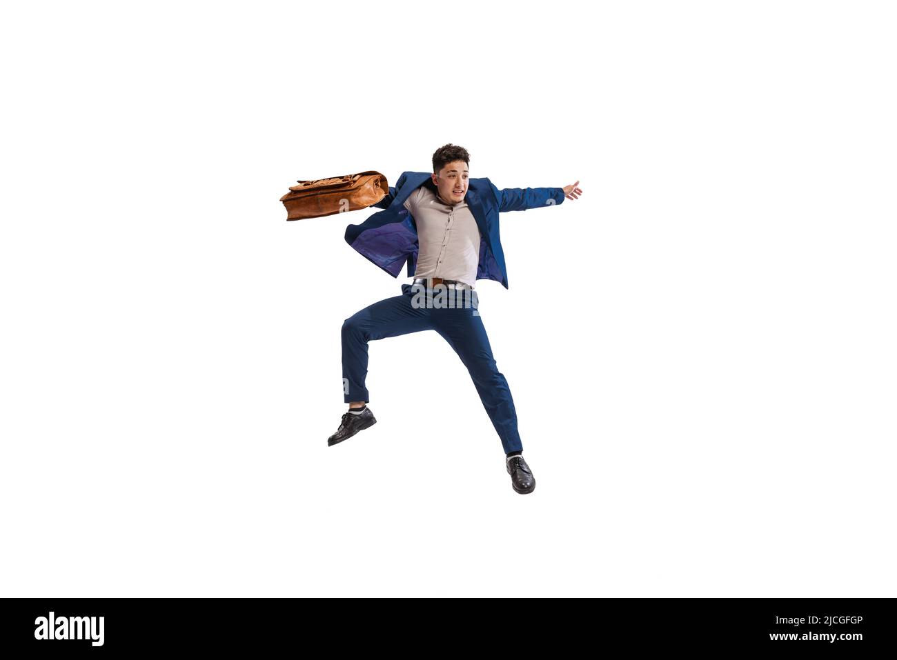 Portrait of young man. office worker in official suit, jumping over ...