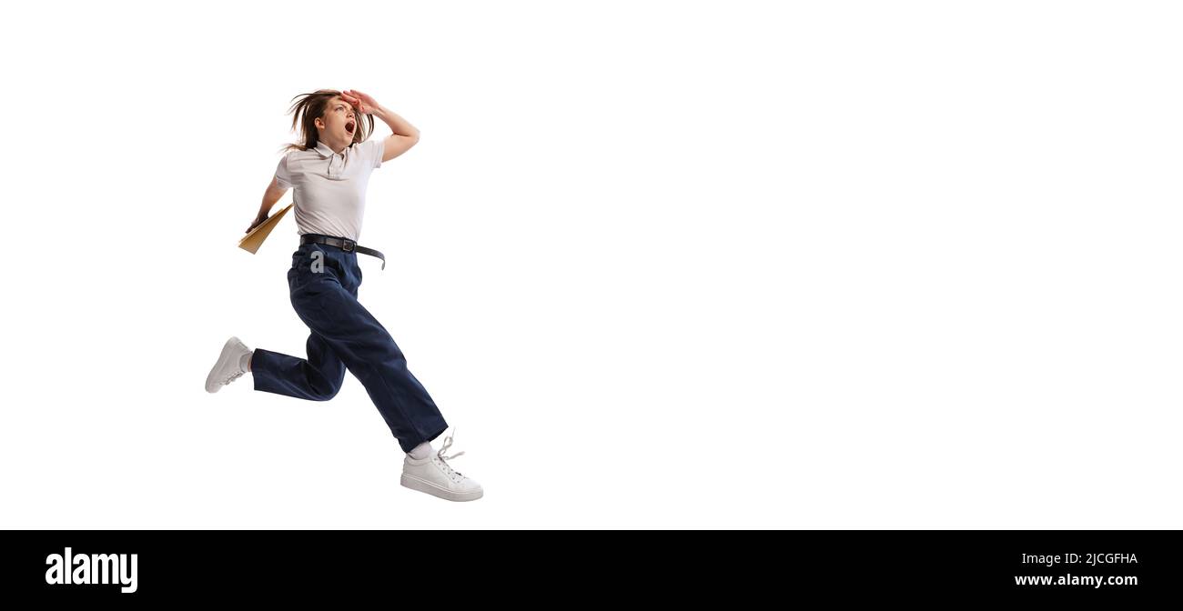 Portrait of young woman, employee being late for work, running isolated ...